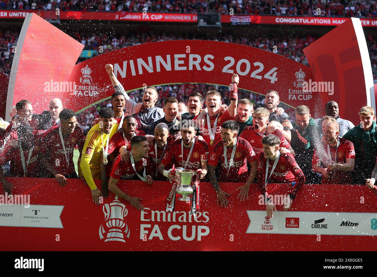 London, UK. 25th May, 2024. Manchester Utd players lift the trophy as ...