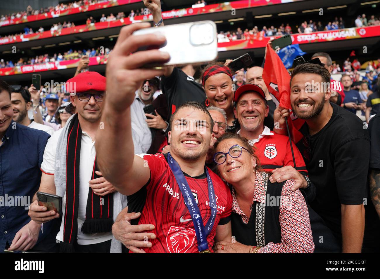 Stade Toulousain's Antoine Dupont celebrates with his family following ...