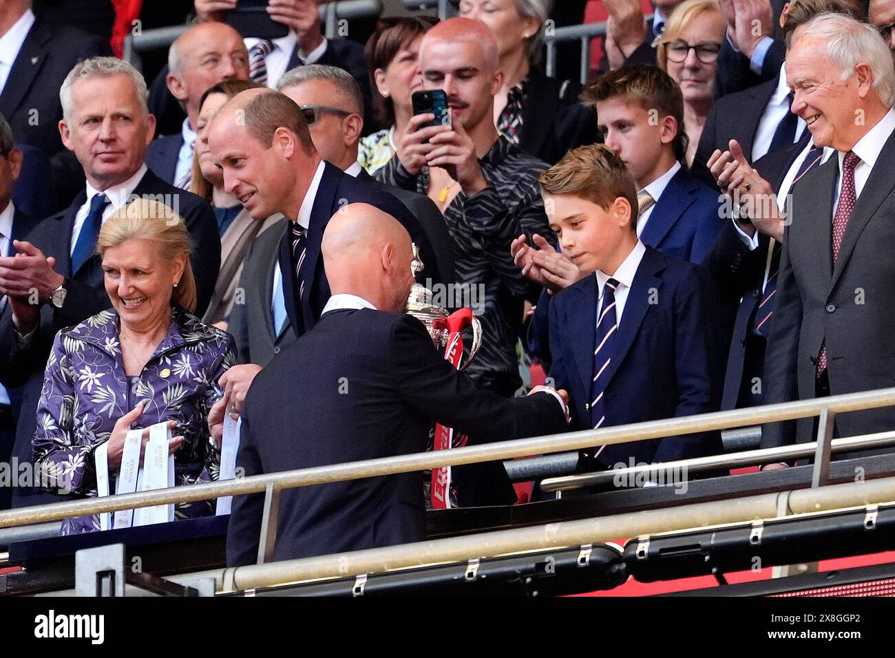 Manchester United manager Erik ten Hag (left) shakes hands with Prince ...
