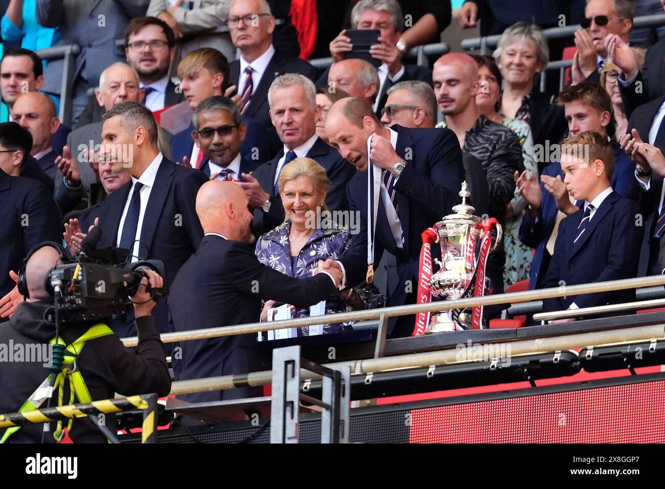 Manchester United manager Erik ten Hag (left) shakes hands with the ...