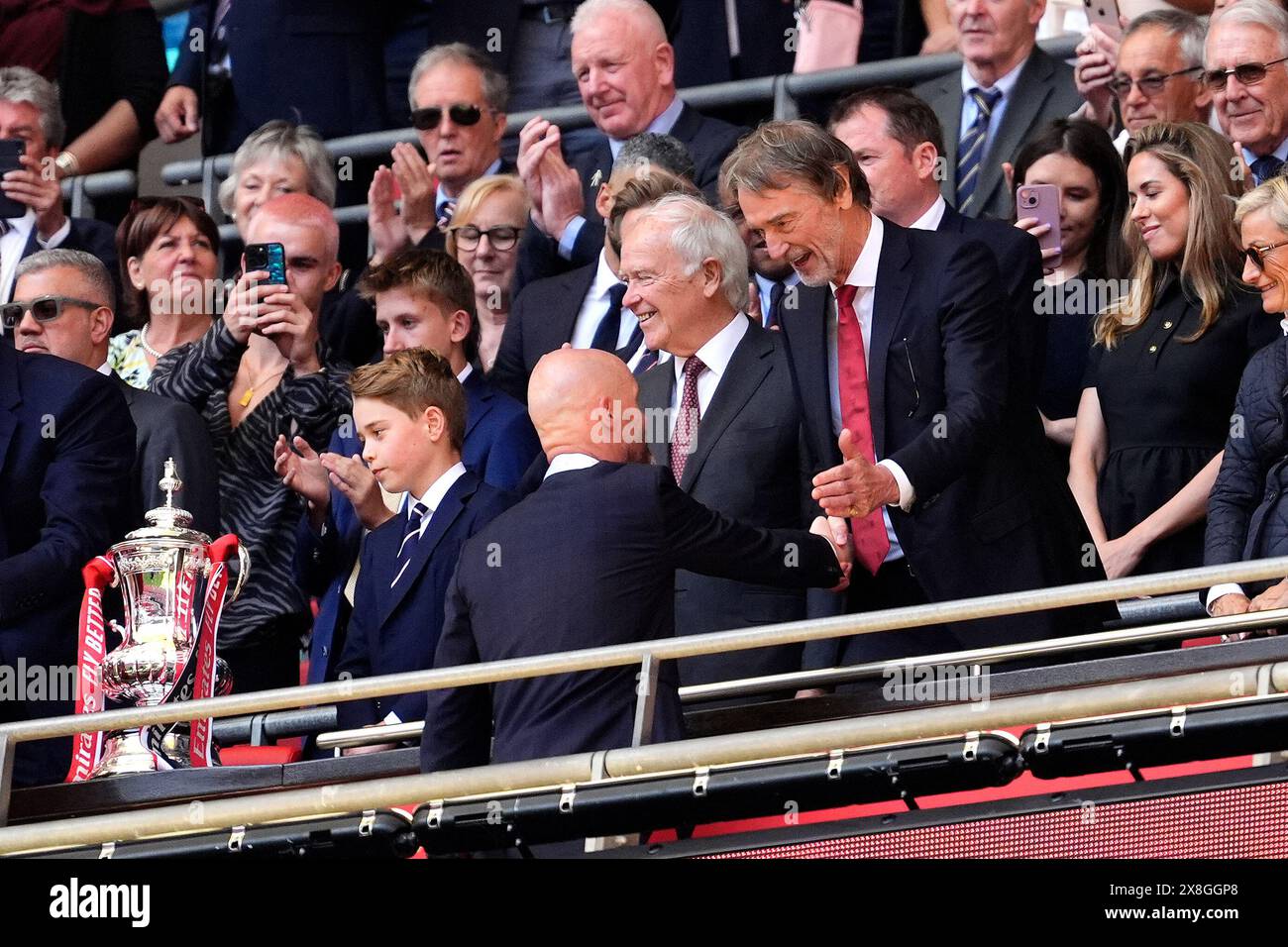 Manchester United manager Erik ten Hag (left) shakes hands with Sir Jim ...