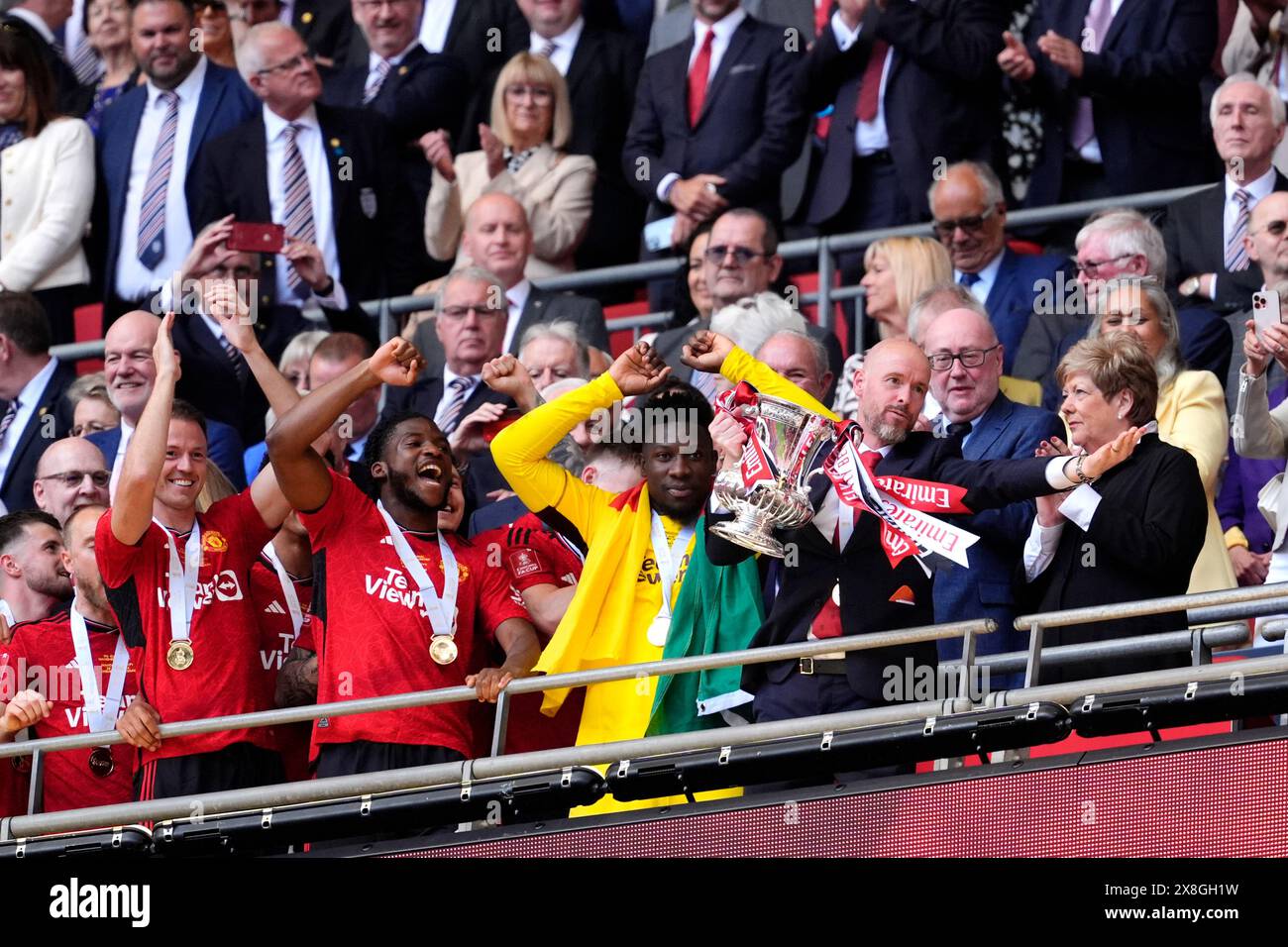 Manchester United manager Erik ten Hag celebrates with the trophy after ...