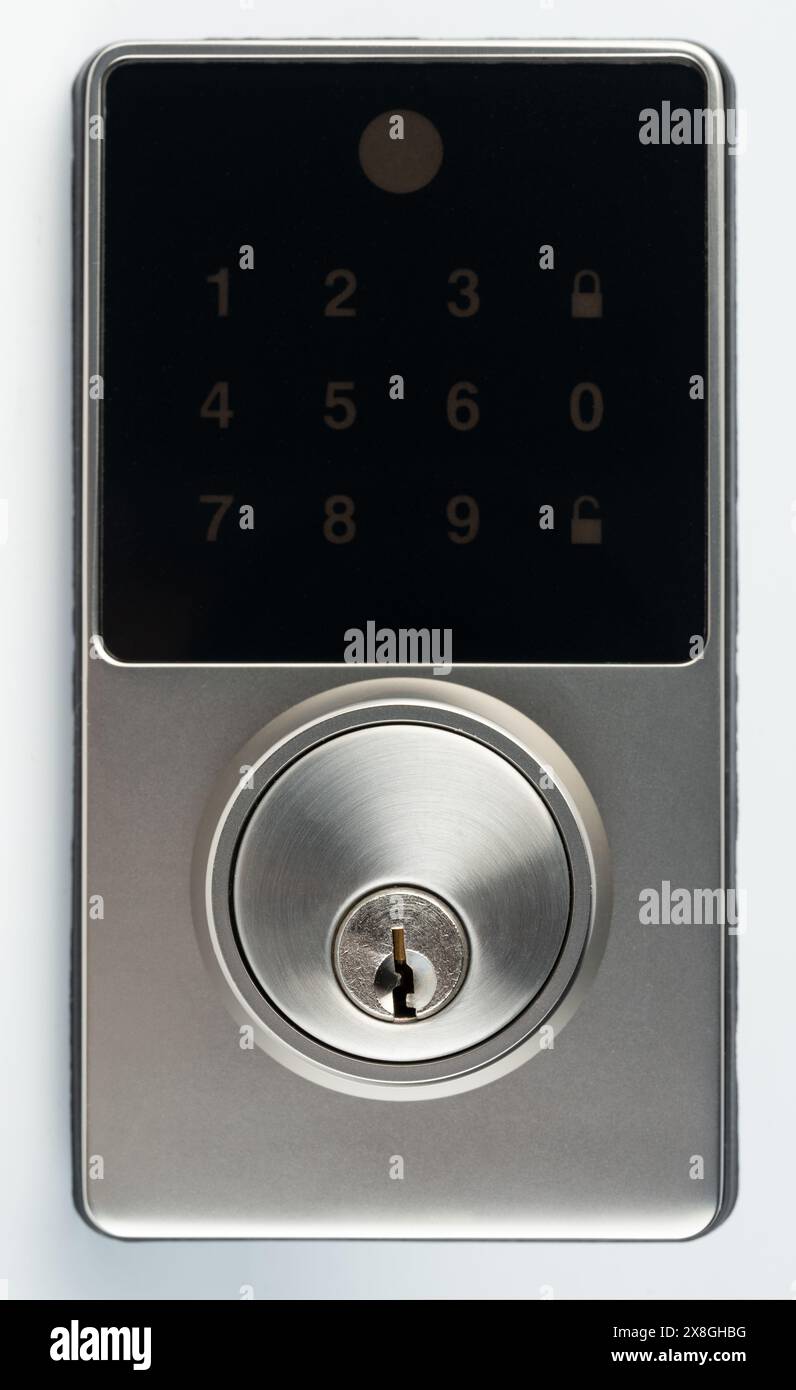 Keyhole with metal code number pad isolated on white studio background ...