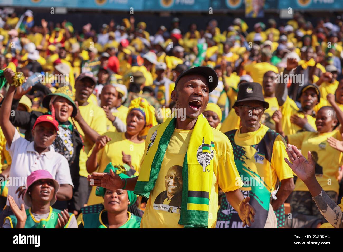 ANC members and supporters chant and wave flags during the final ...