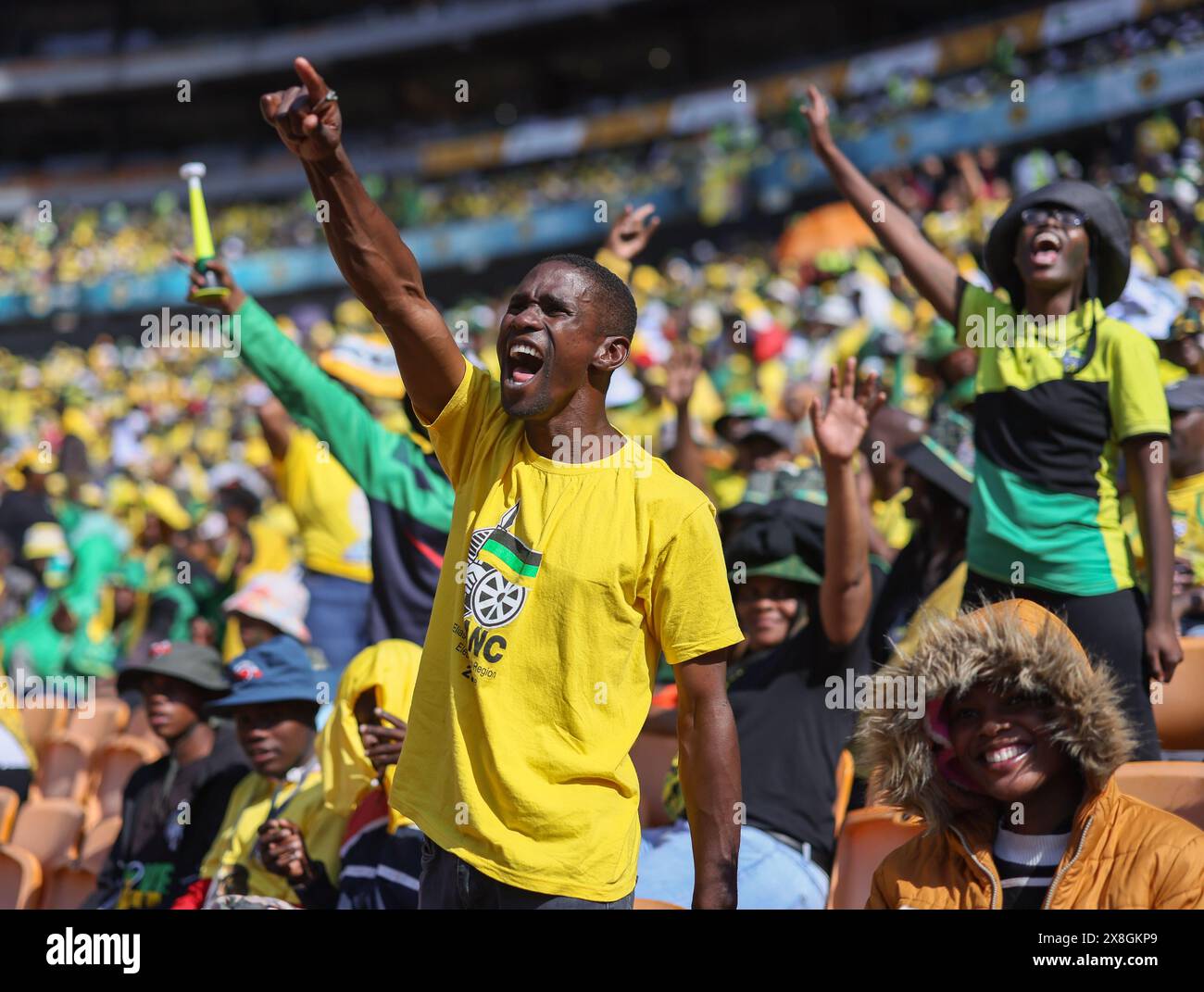 Fans and supporters chant and wave flags during the final African ...