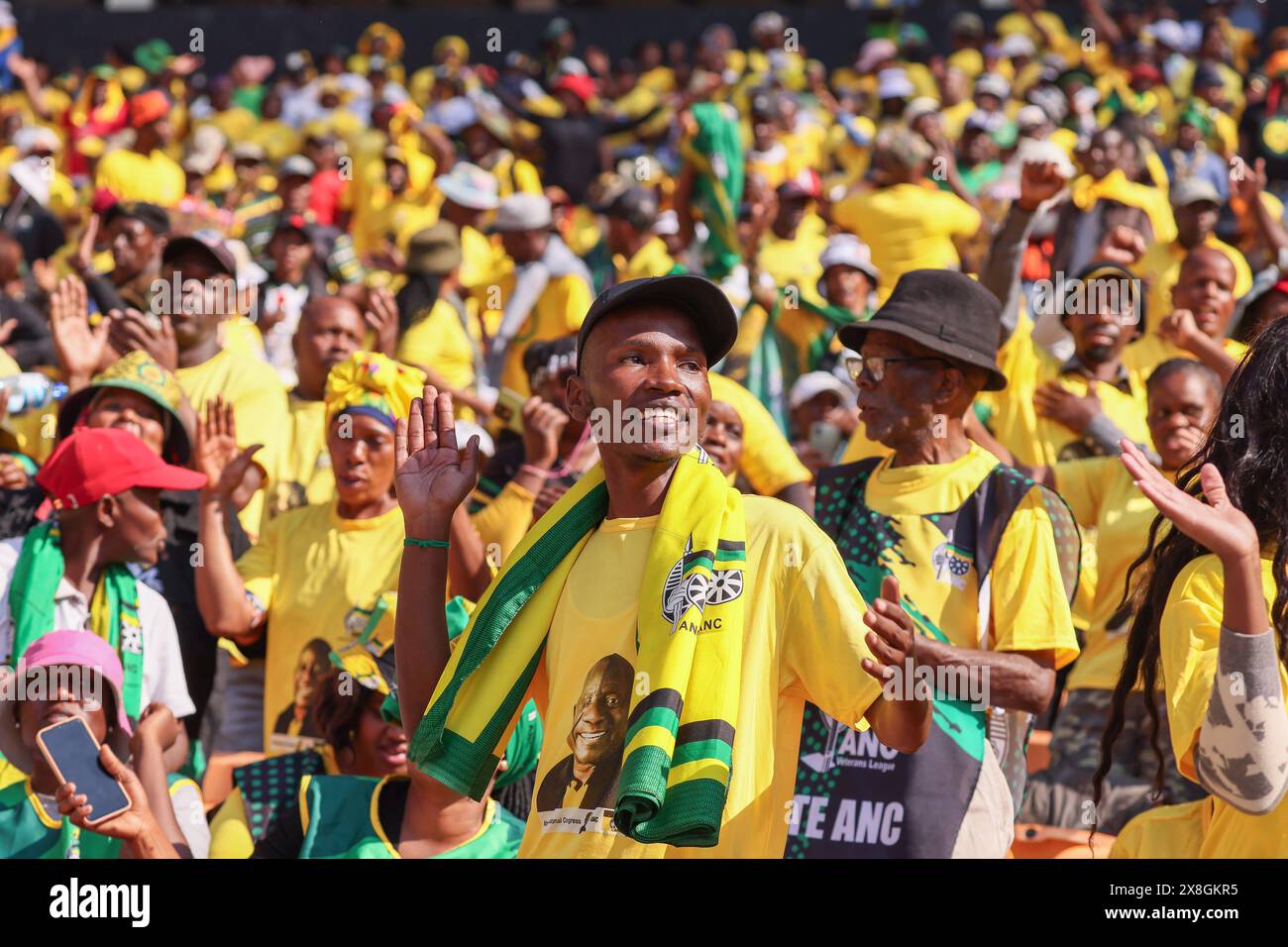 ANC members and supporters chant and wave flags during the final ...
