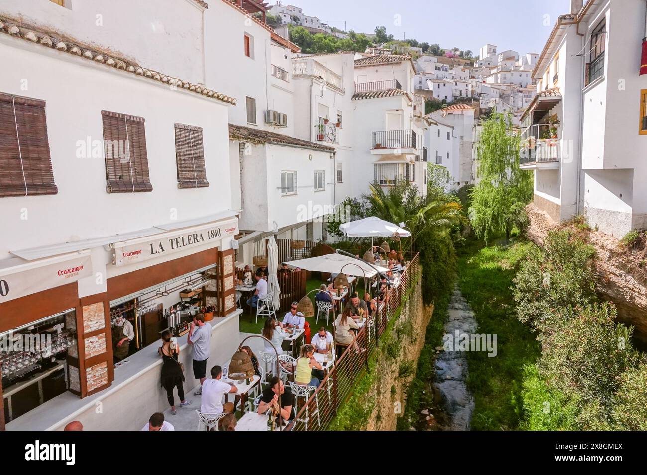 Restaurants and cafes crowd along the Calle Cuevas de la Sombra on the ...