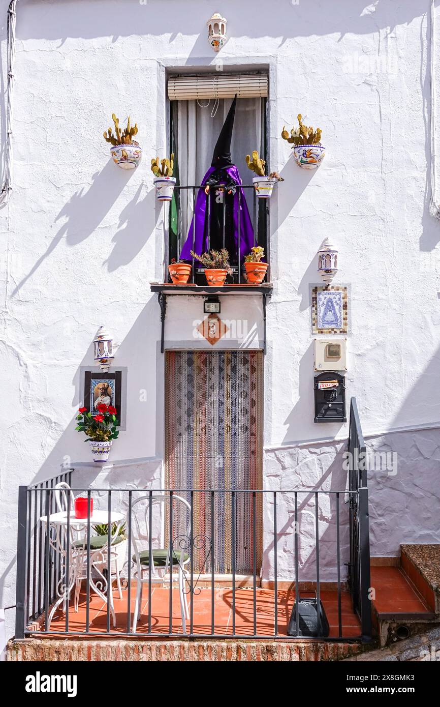 A doll made to look like a Nazarenos wearing traditional cone hat and ...