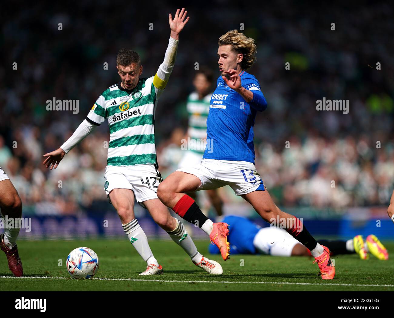 Celtic's Callum McGregor and Rangers' Todd Cantwell (right) battle for ...