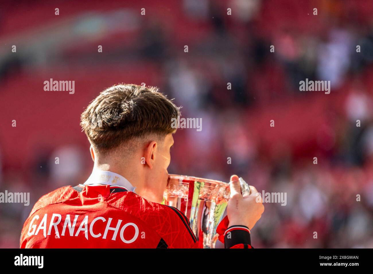 London, UK. 25th May, 2024. Alejandro Garnacho of Man Utd with trophy ...