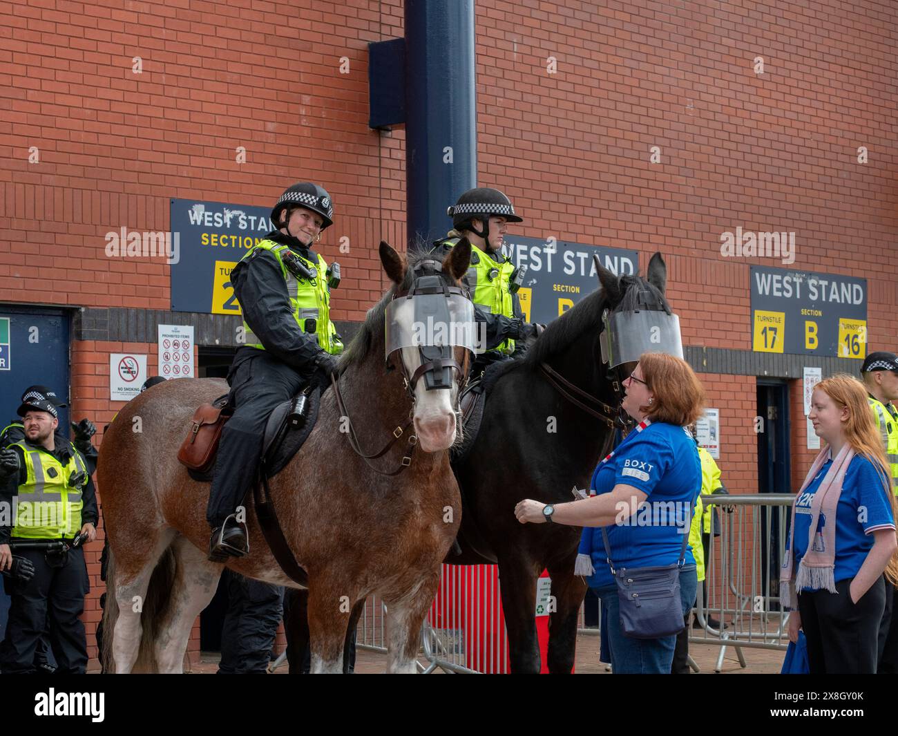 Glasgow, Scotland, UK. May 25th, 2024: A Rangers talking to a mounted ...