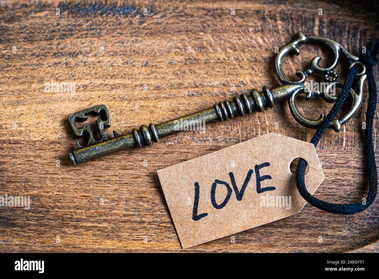 Vintage key with tag and inscription love on it. Concept love and ...