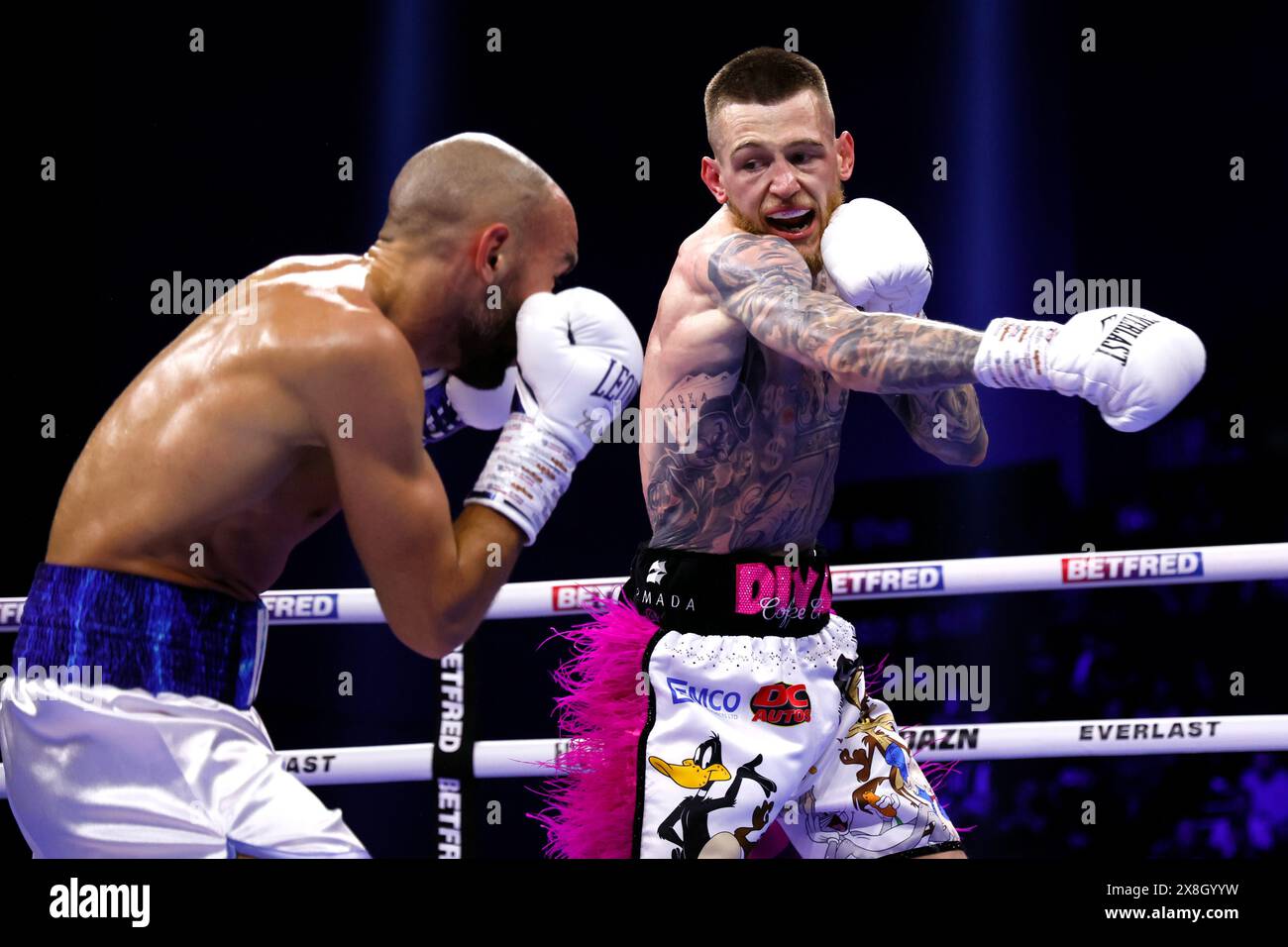 Gary Cully (right) in action against Francesco Patera in the light bout ...