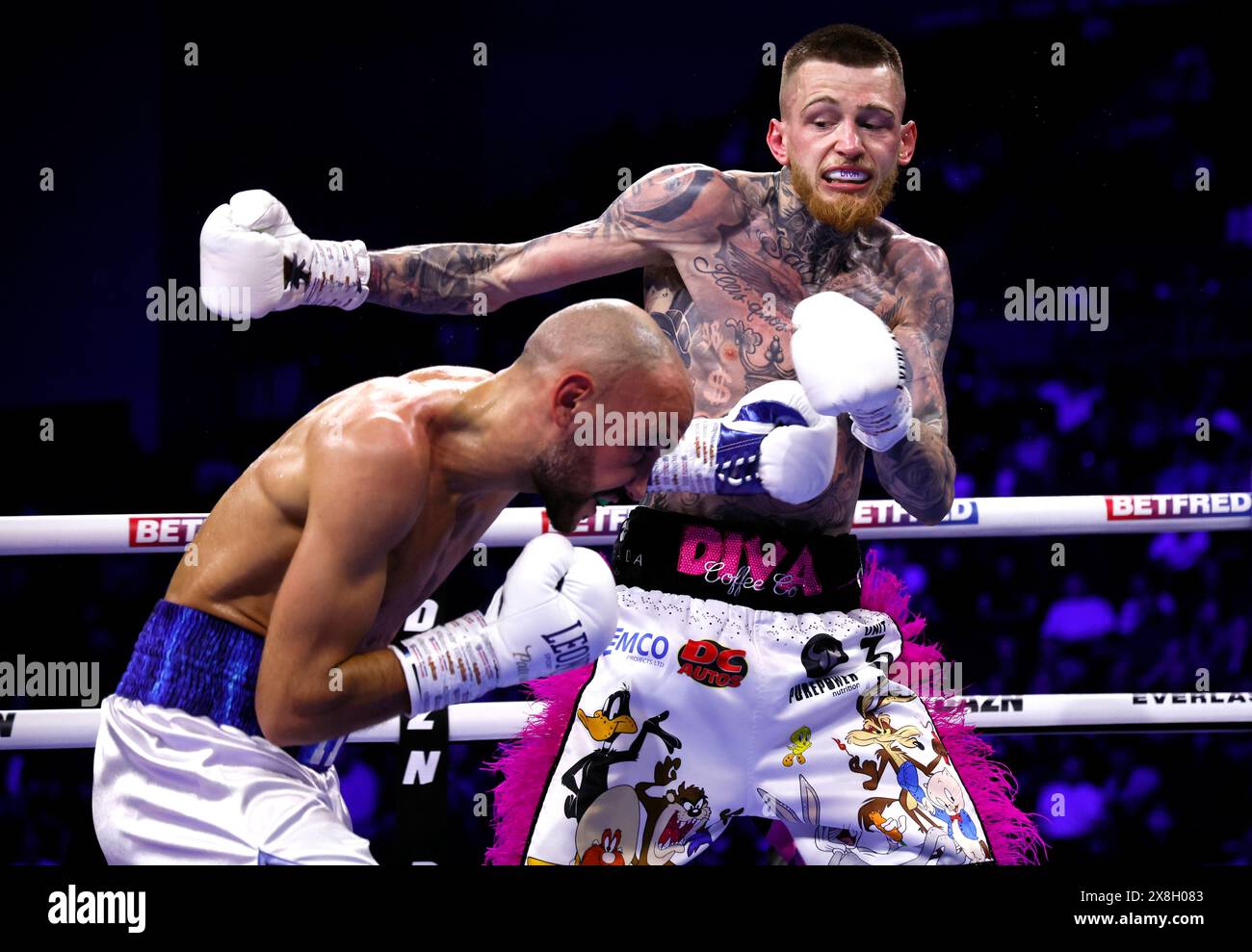 Gary Cully (right) in action against Francesco Patera in the light bout ...