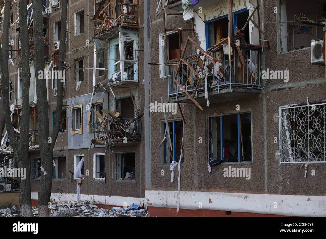 Image of a heavily damaged multi-storey residential building after a ...
