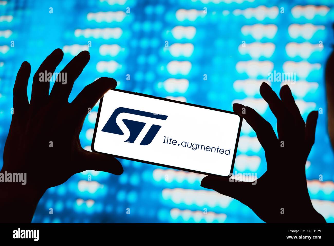 In this photo illustration, the STMicroelectronics logo is displayed on ...