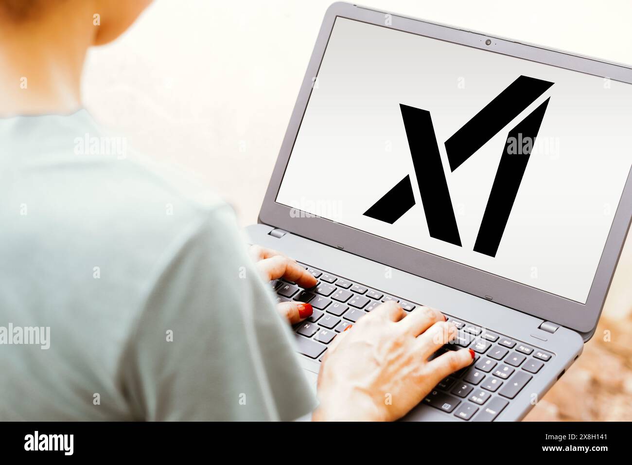 In this photo illustration, the xAI logo is seen displayed on a laptop ...