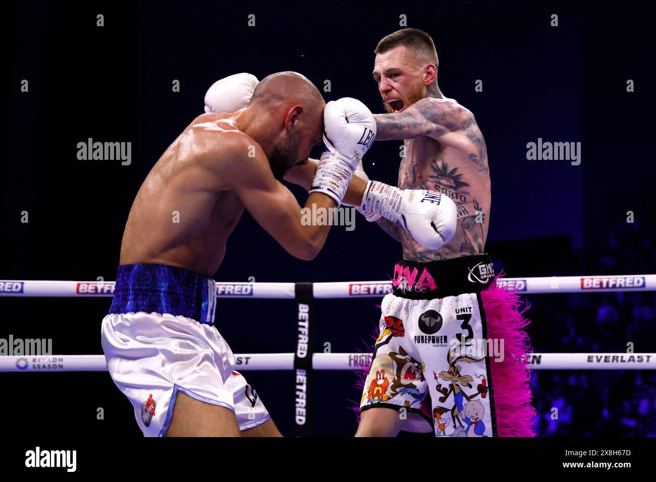 Gary Cully (right) in action against Francesco Patera in the light bout ...
