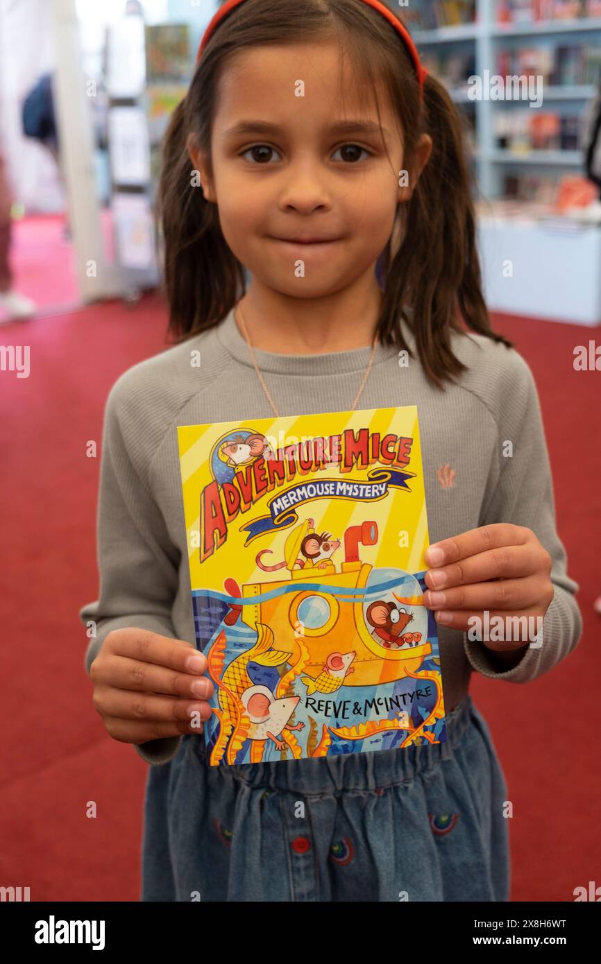 Little girl holding her book shop signing queue Adventure Mice by kids ...