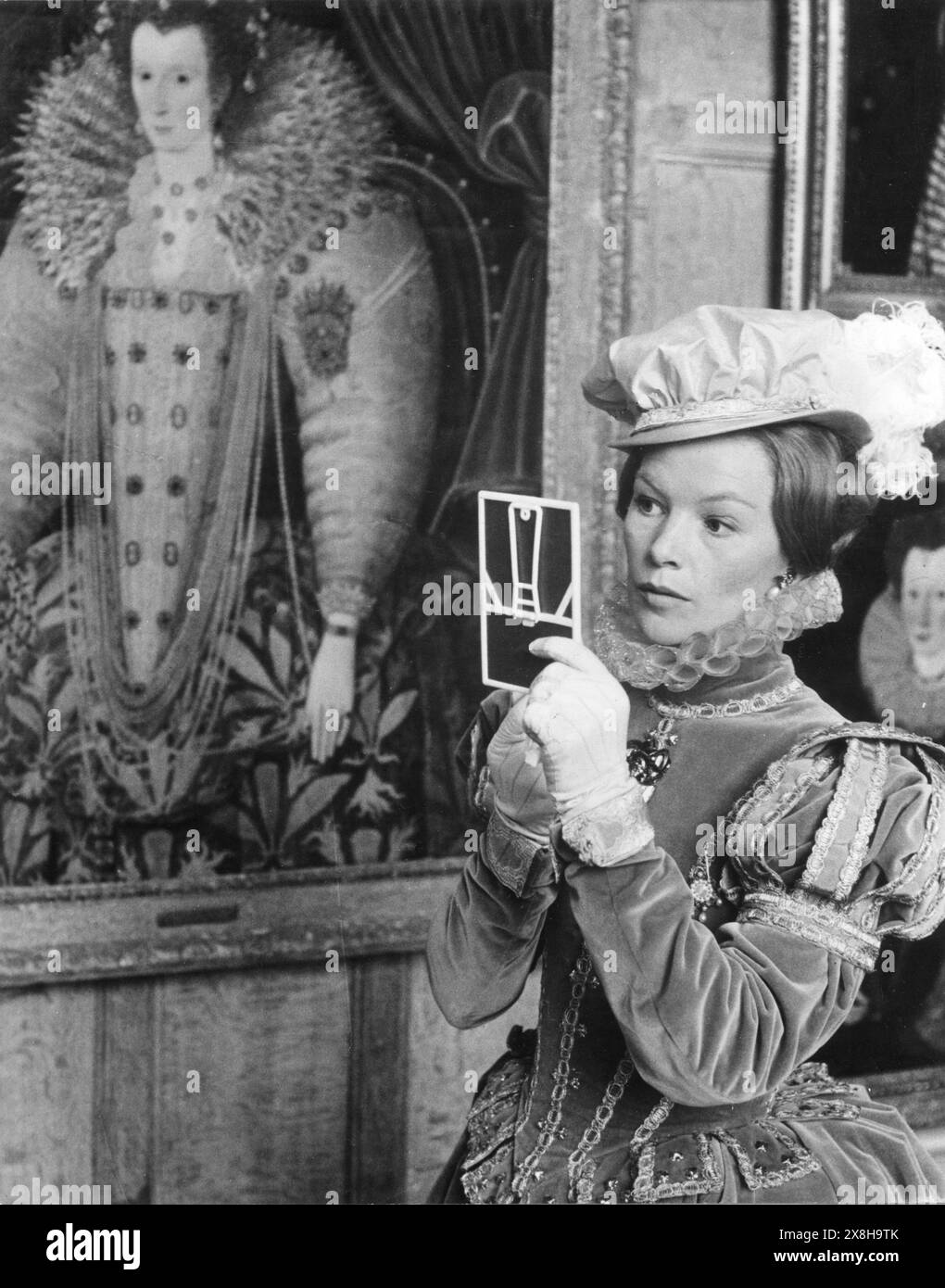 GLENDA JACKSON in costume for her role as Elizabeth I checks herself in ...