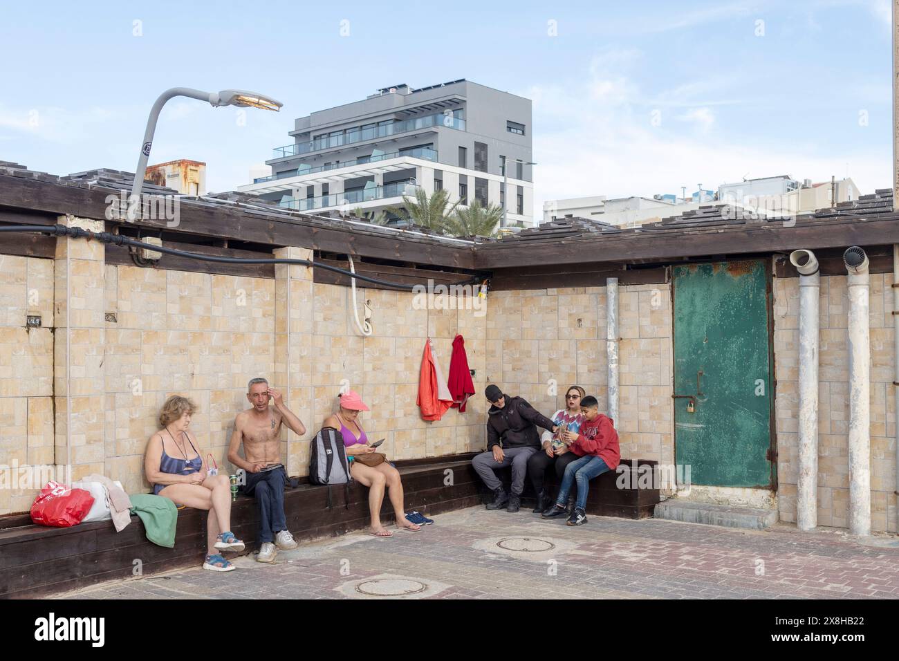 Haifa, Israel - March 23, 2024, People at the sea are sitting on a ...