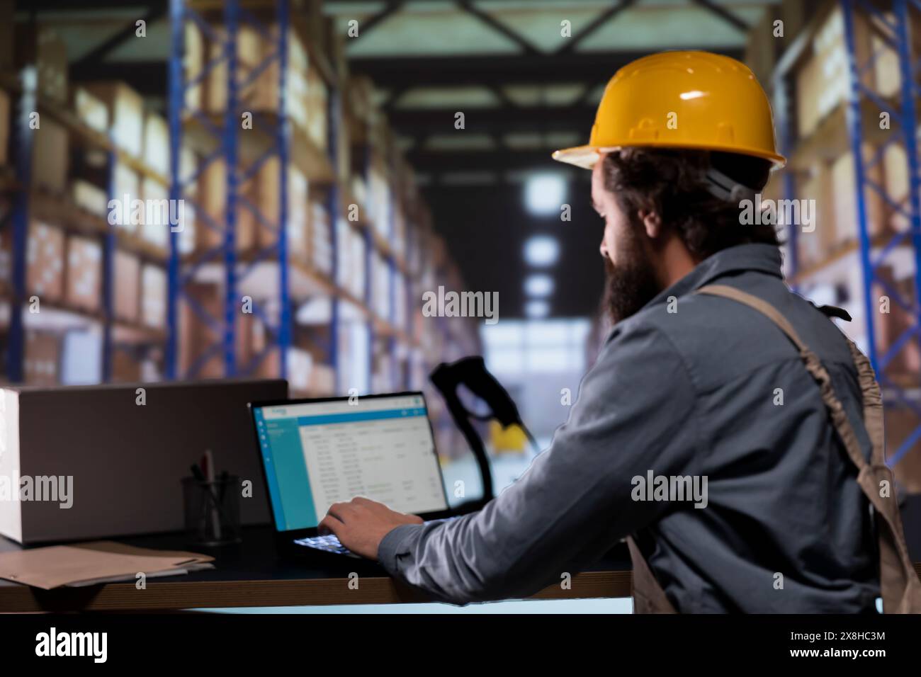 Warehouse employee doing quality control on products, preparing ...