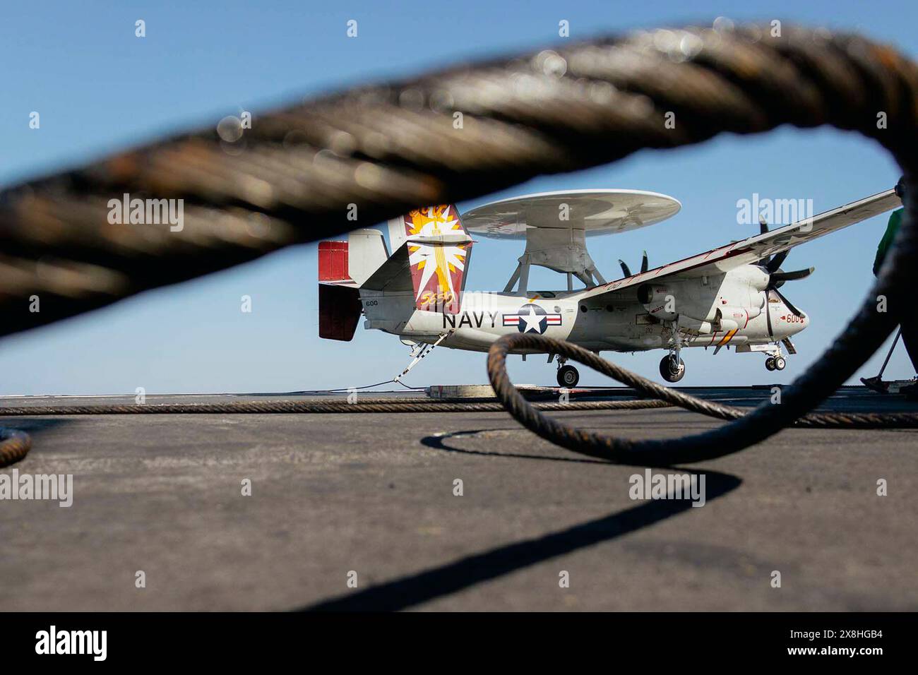 An E-2C Hawkeye lands on the flight deck of the aircraft carrier USS ...