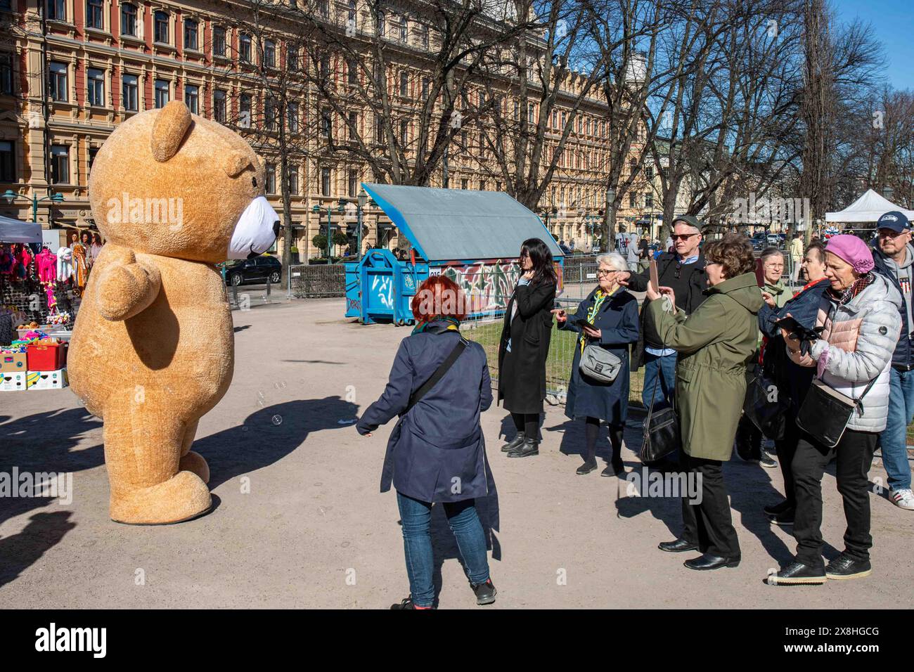 People taking pictures of giant teddy bear on May Day Eve in Esplanade ...