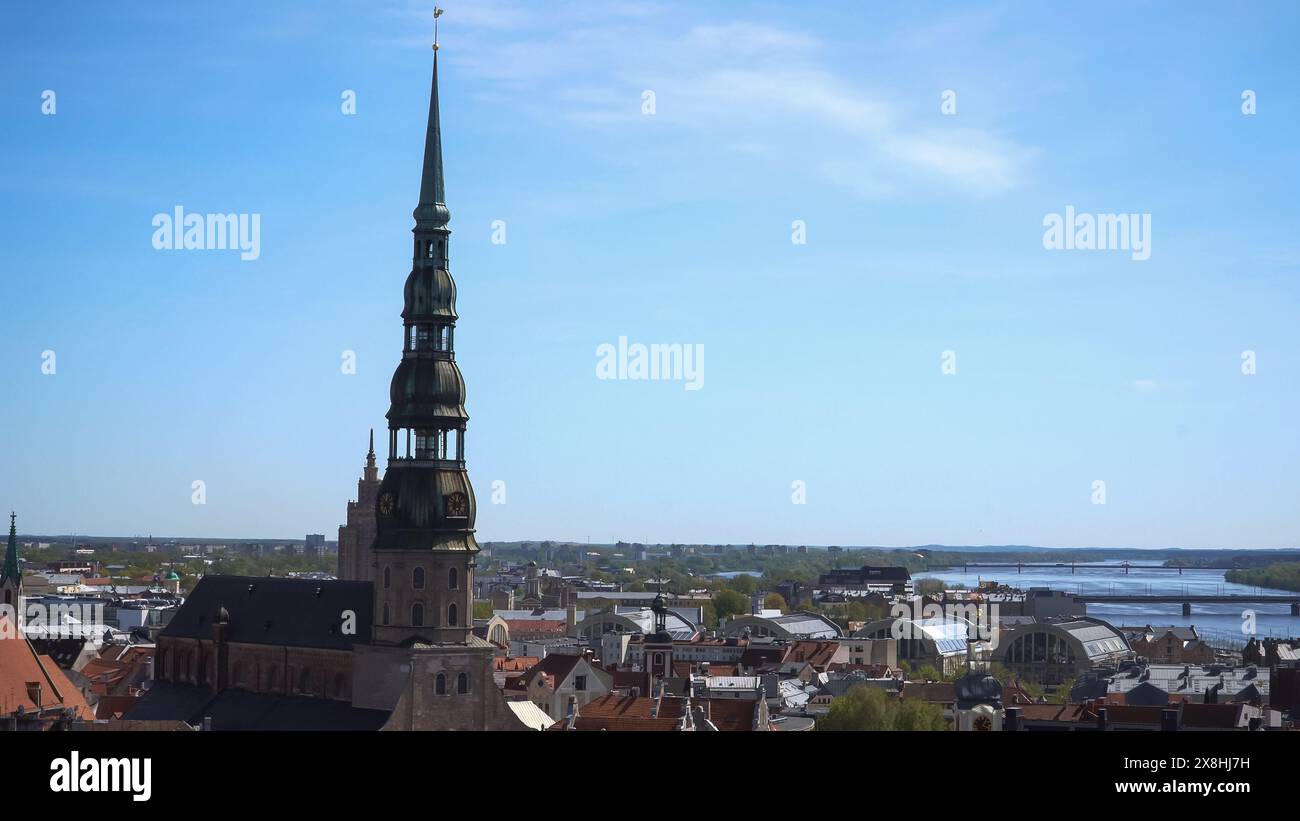 The spire of Riga St Peter's Church tower in a scenic aerial view of ...
