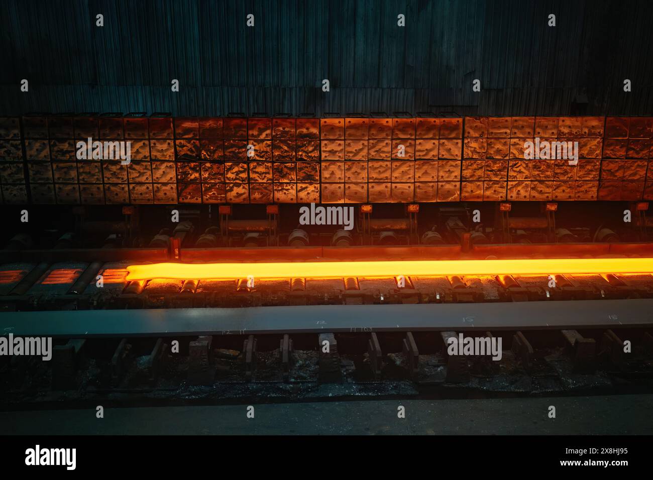Rolled metal factory. Hot iron slab moving on conveyor of metal rolling mill Stock Photo - Alamy