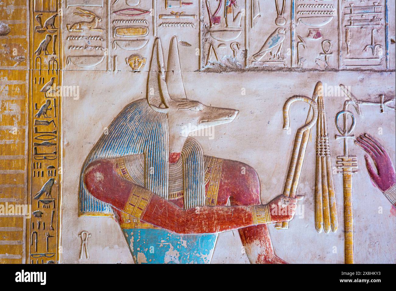 A relief inside the Temple of Seti I in Abydos, Egypt, showing Anubis ...