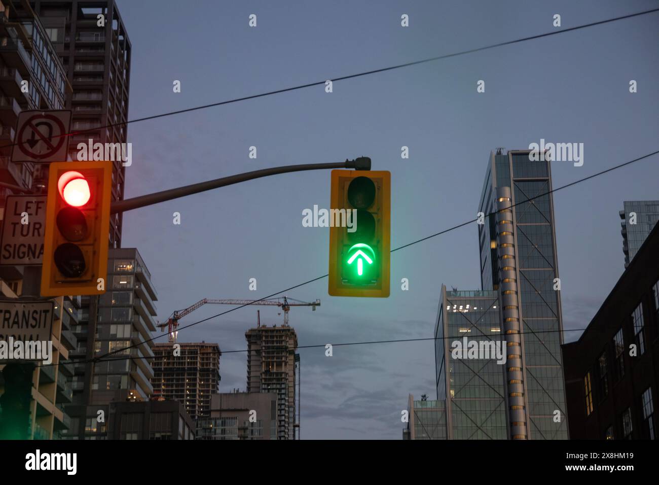 Evening cityscape - red stop lights - skyscrapers and construction ...