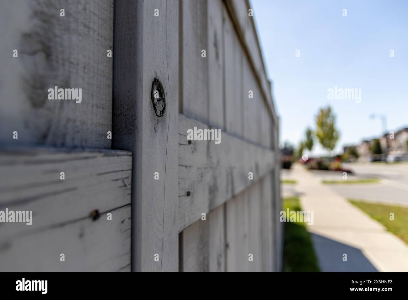 Close-up view of weathered wooden fence - suburban neighborhood ...