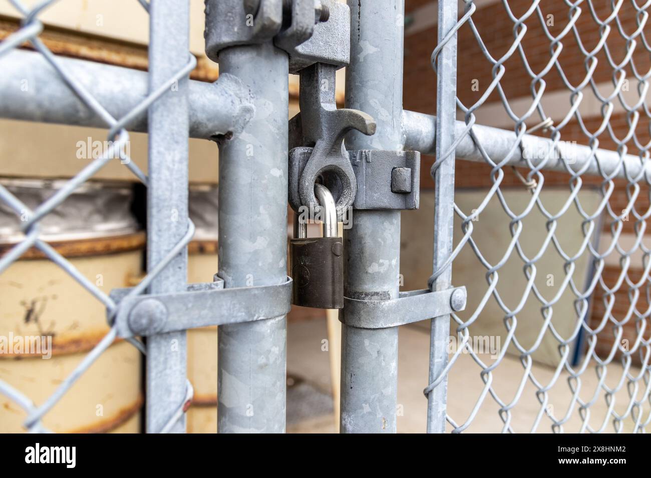 Close-up view of sturdy metallic padlock - chain-link fence gate ...