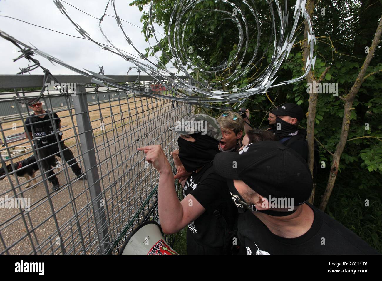 Huntingdon, England, UK. 25th May, 2024. Protesters engage in ...