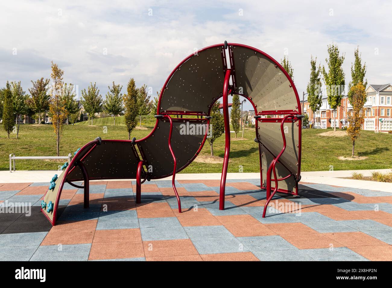Modern playground equipment - red and grey - set on colorful rubber ...