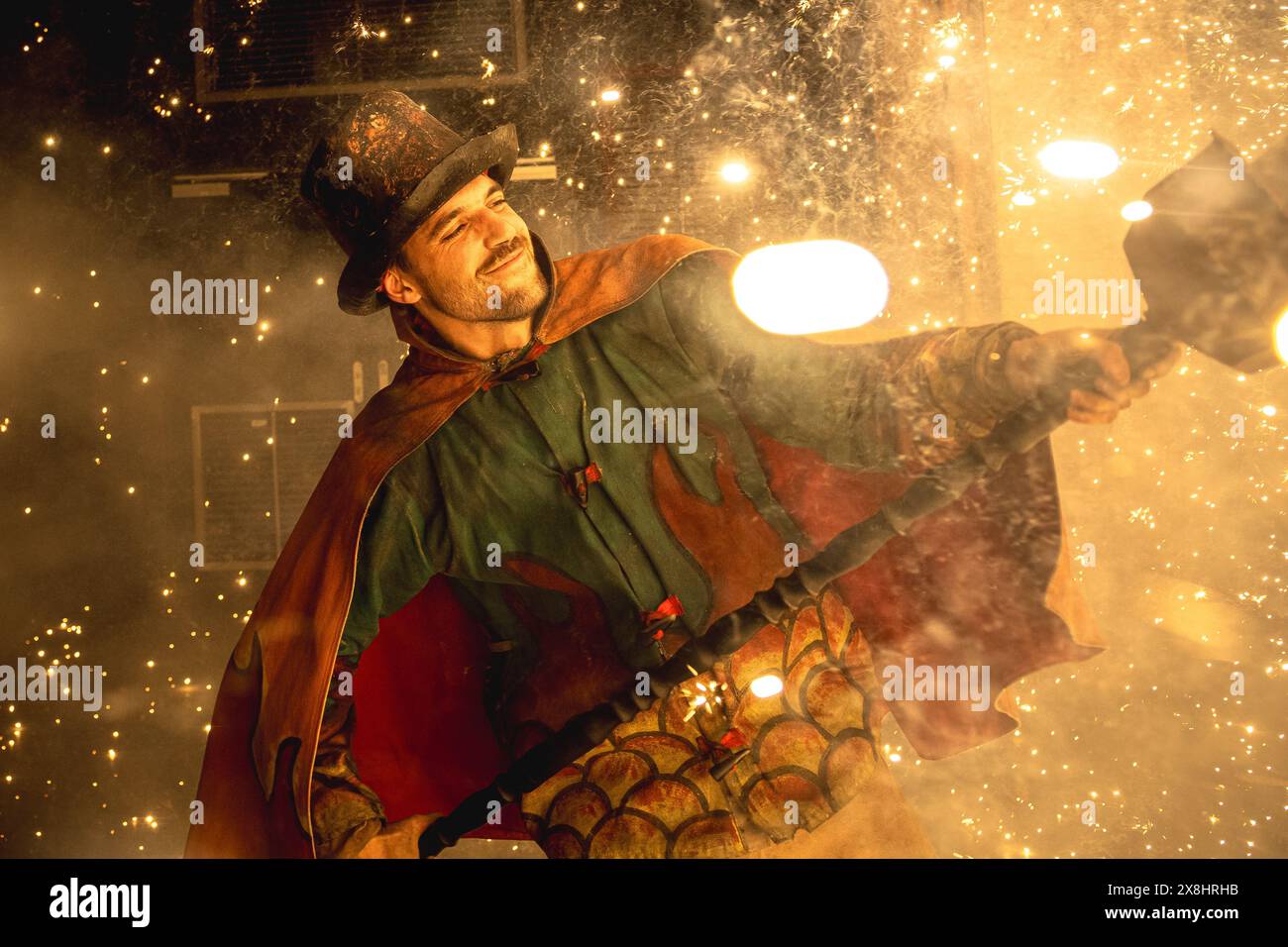 Barcelona, Spain. 25 May, 2024: A fire runner dances to traditional ...