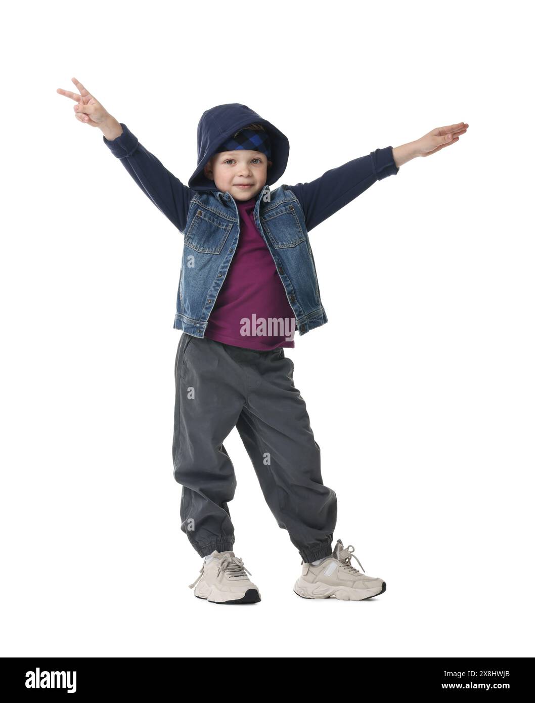 Happy little boy dancing on white background Stock Photo - Alamy