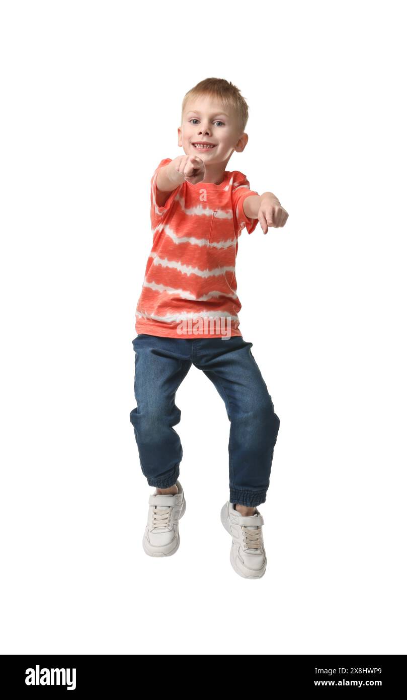 Happy little boy dancing on white background Stock Photo - Alamy