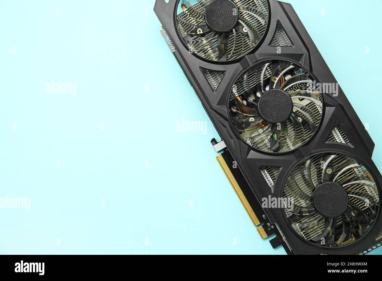 One graphics card on light blue background, top view. Space for text ...