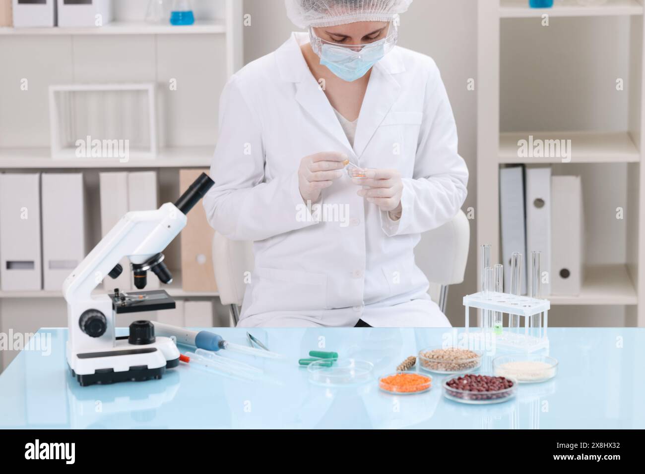 Quality control. Food inspector checking safety of products in ...