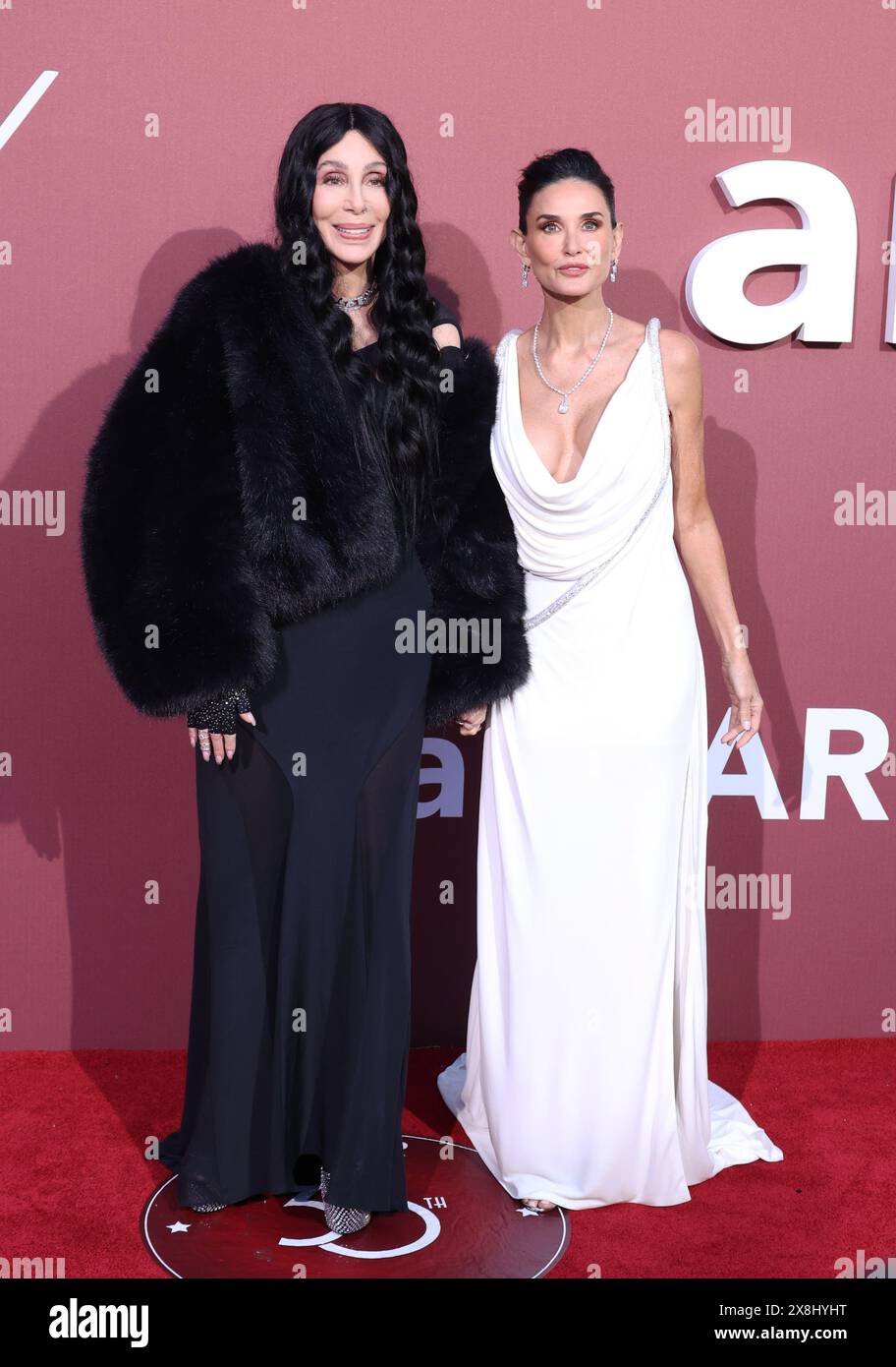 Cher and Demi Moore attends the amfAR Cannes Gala 30th edition ...