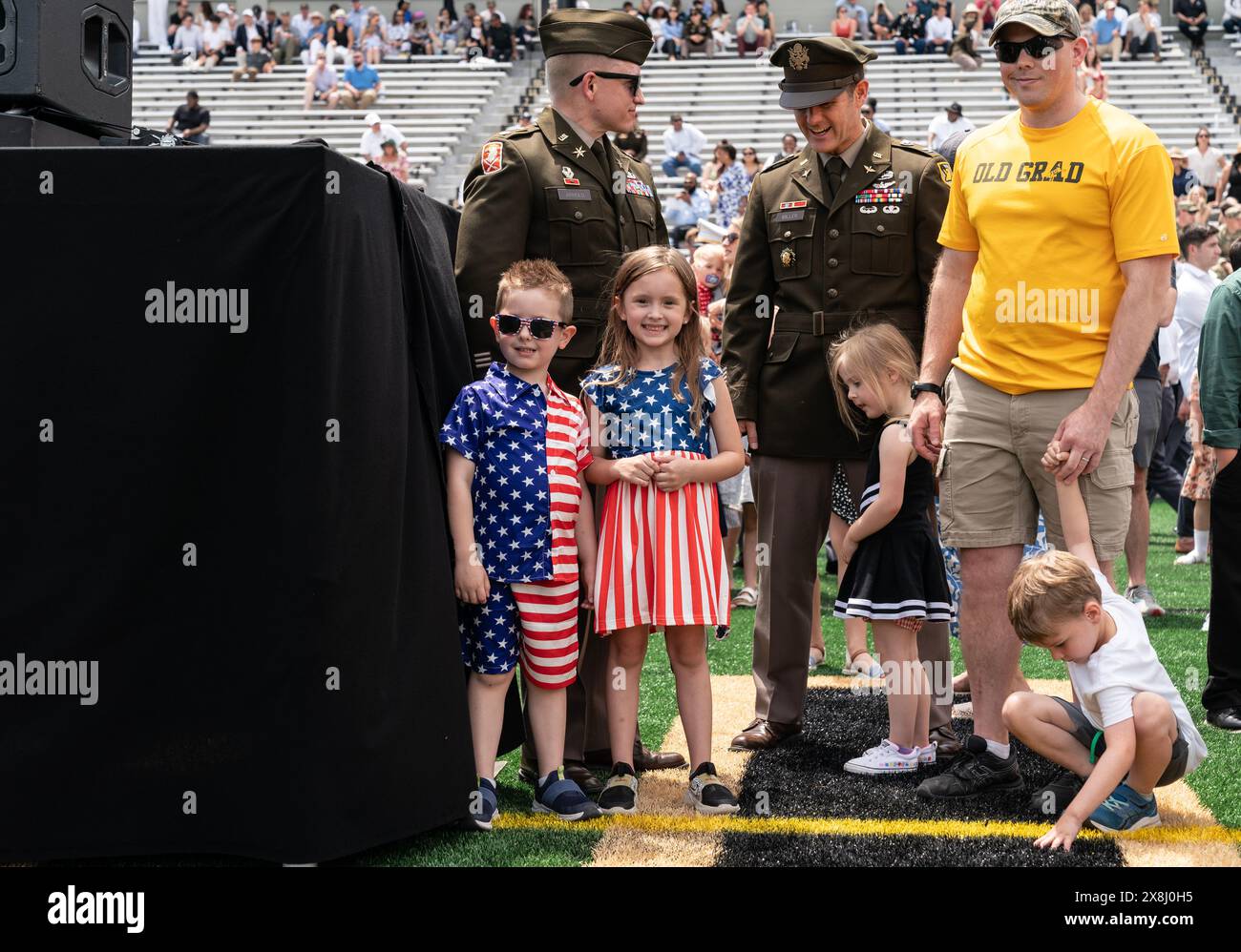 Boys and girls prepare to run to get cadet's hat they will throw into ...