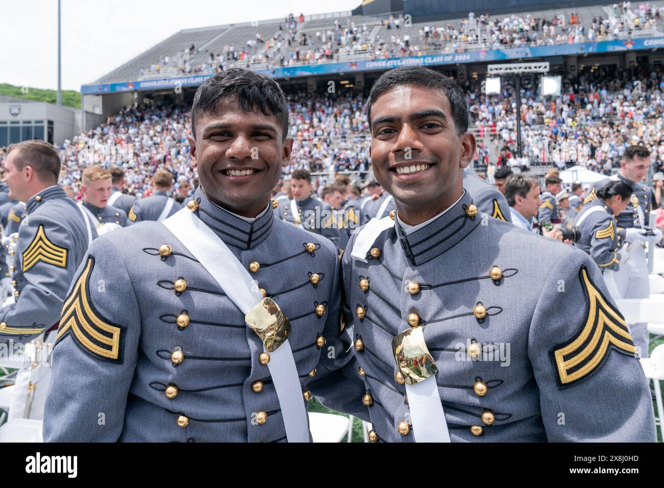 Graduates celebrate after receiving diplomas during U.S. Military ...