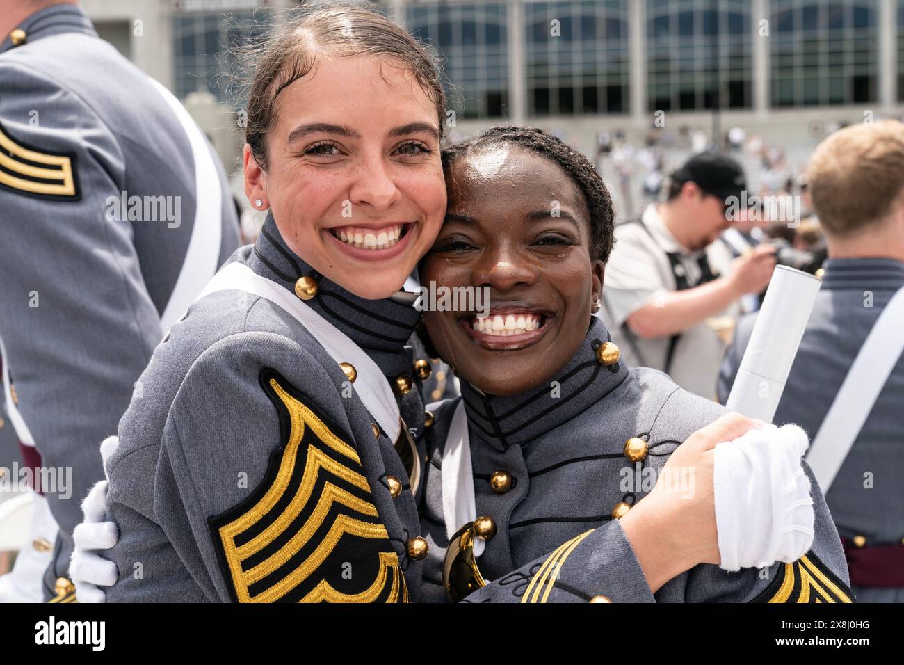 Graduates celebrate after receiving diplomas during U.S. Military ...