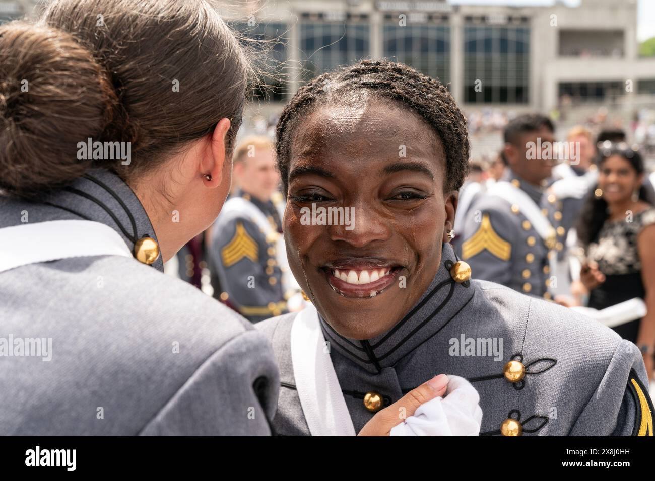 Graduates celebrate after receiving diplomas during U.S. Military ...