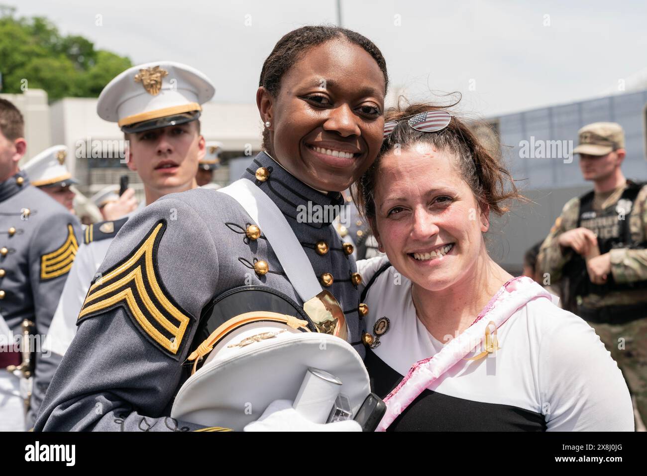 Graduates celebrate after receiving diplomas during U.S. Military ...