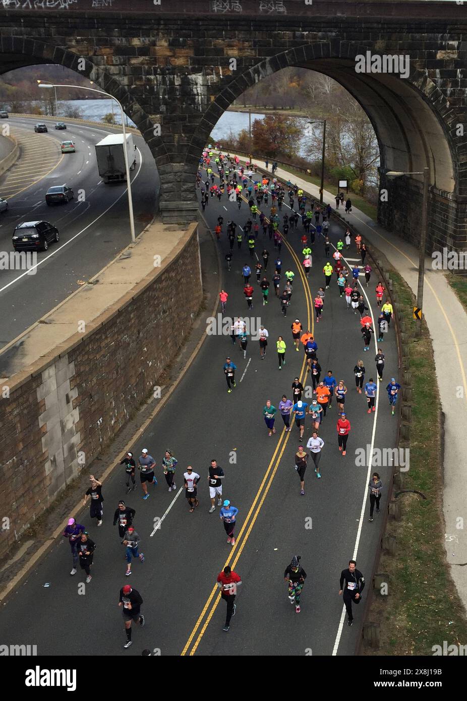 Runners in the Philadelphia Marathon head south on MLK Drive while cars ...
