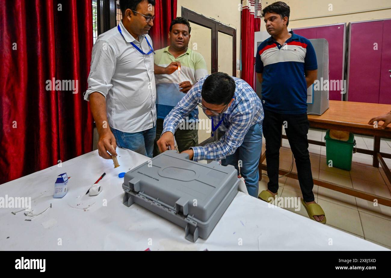 NEW DELHI, INDIA - MAY 25: A polling official sealing the Electronic ...