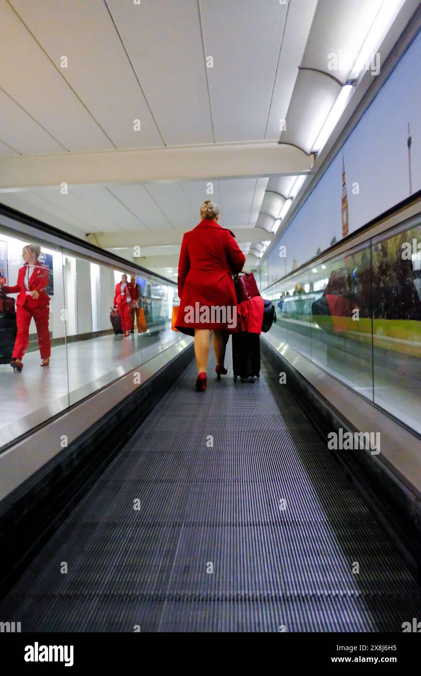 Airline Staff walking to/from a flight through the airport Stock Photo ...